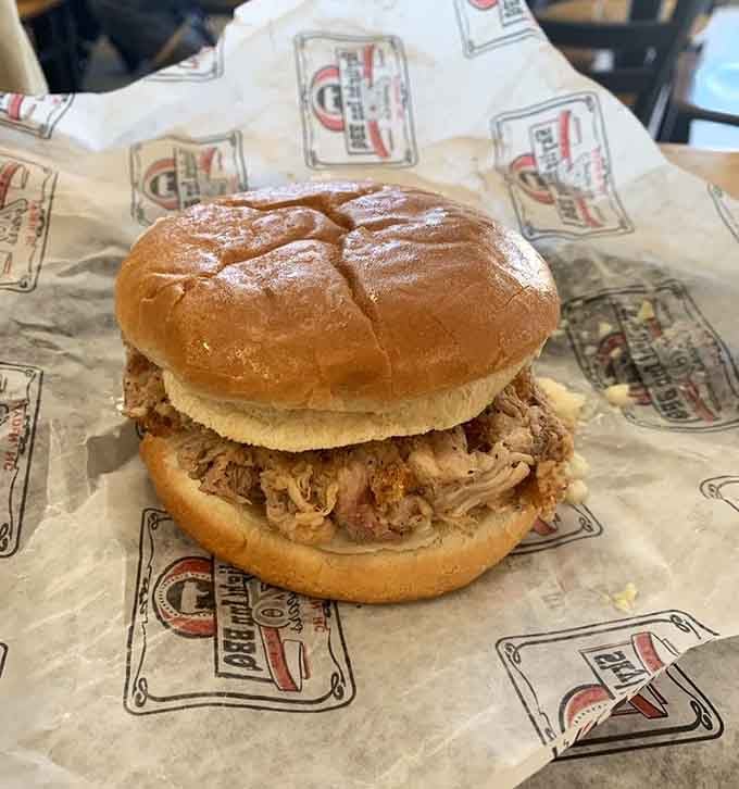 That pulled pork sandwich isn't playing around &mdash; smoky, tender, and piled high on a perfectly toasted bun.