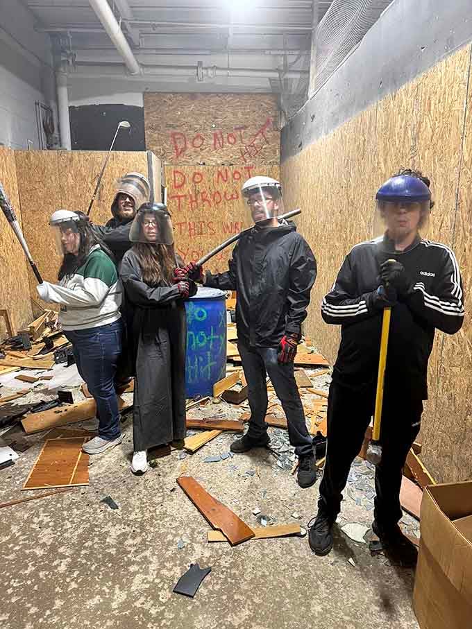 Nothing says "we had the best night ever" quite like posing in full protective gear surrounded by glorious destruction.