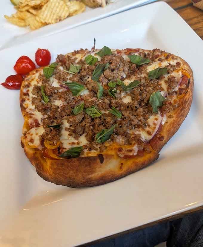 When flatbread gets topped with savory goodness and fresh herbs, magic happens on your plate, friends.