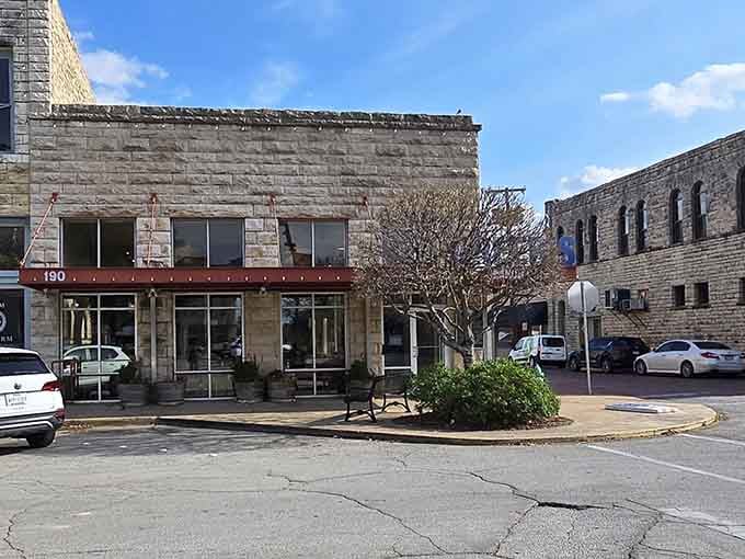 A limestone corner building with a bright red door, downtown Stephenville serves up character with every square inch.