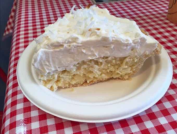 Coconut Cream pie piled high with fluffy topping, making every other dessert look seriously underdressed by comparison.