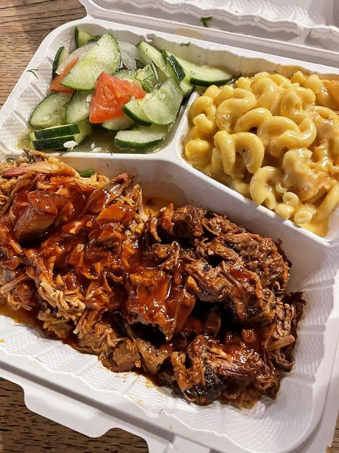 Smoky pulled pork beside creamy mac and cheese and a crisp cucumber salad. Balance never looked this delicious.
