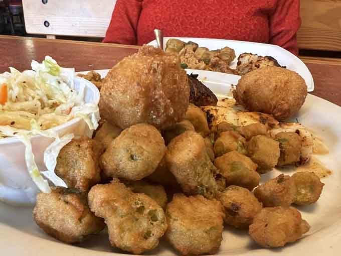 Fried oysters piled high with sweet potato fries and a lemon wedge that means serious business.