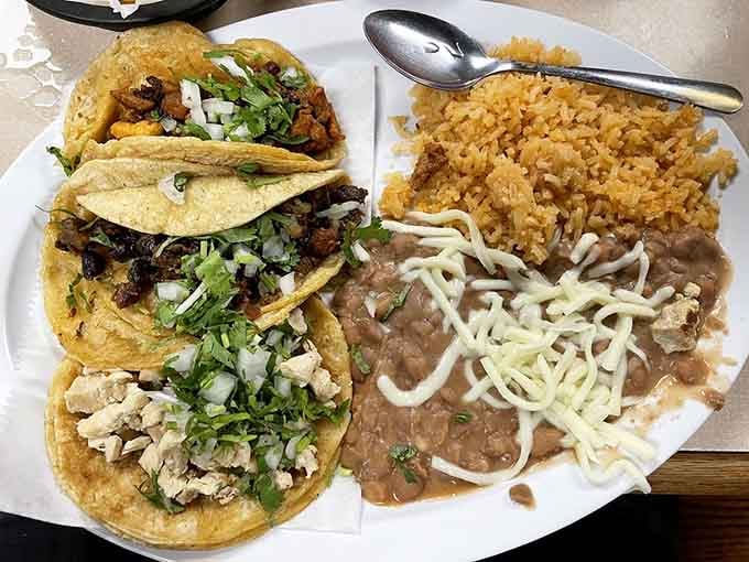 A full spread of street-style tacos with rice and beans. This is what a good Tuesday looks like.