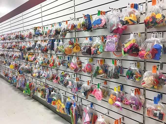 Hundreds of little bagged surprises hanging on the wall, because even toys deserve a second act.