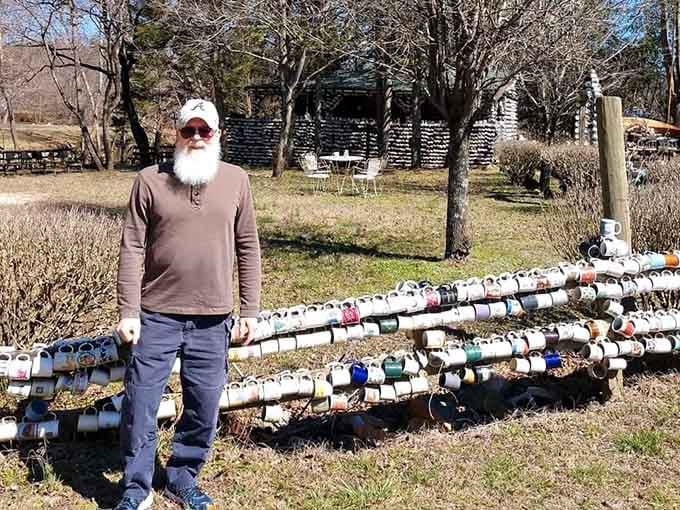 Standing next to a mug fence in North Carolina, looking like a man who has figured something out.