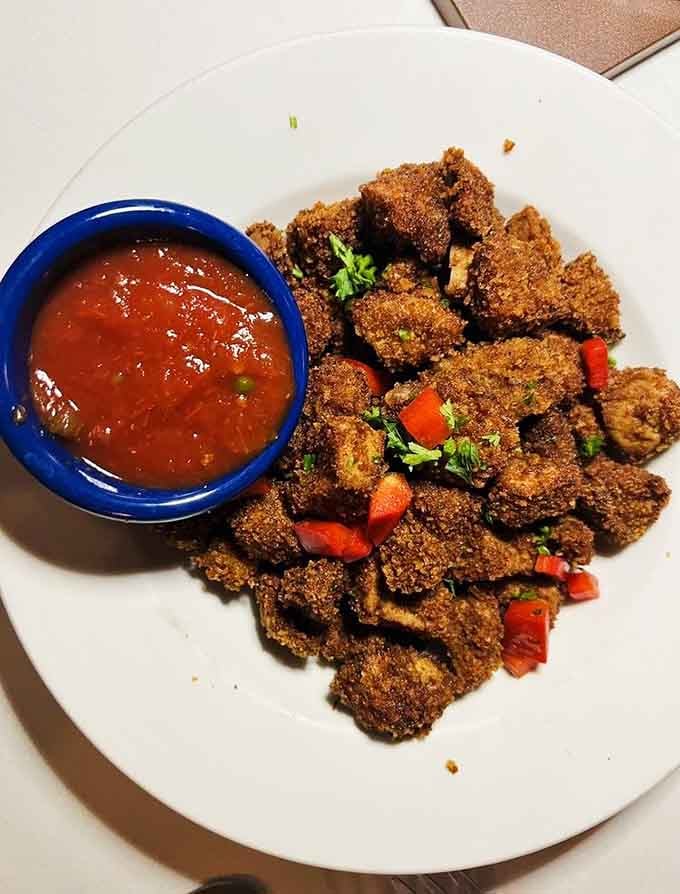 Golden, crispy, and served with salsa. Rocky Mountain Oysters: the appetizer that separates the curious from the cautious.