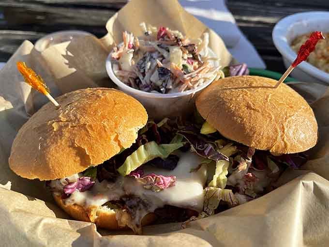 Two burgers topped with melted cheese and fresh greens, because sometimes one just isn't enough for the soul.