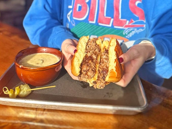 Brisket and cheddar on a toasted brioche bun, with cornbread on the side. Somebody in that kitchen really cares.