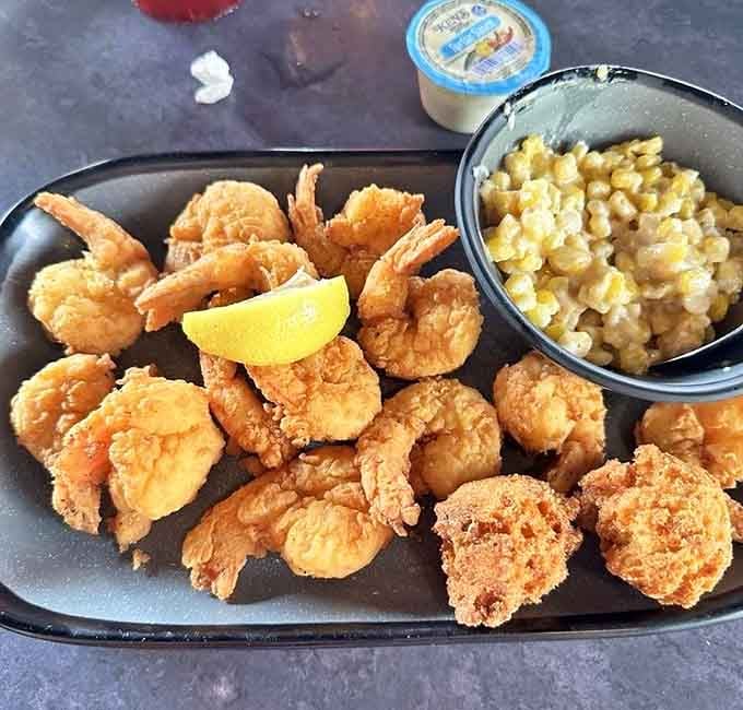 Perfectly fried shrimp with a wedge of lemon and honey skillet corn, coastal Florida never looked this satisfying on a plate.