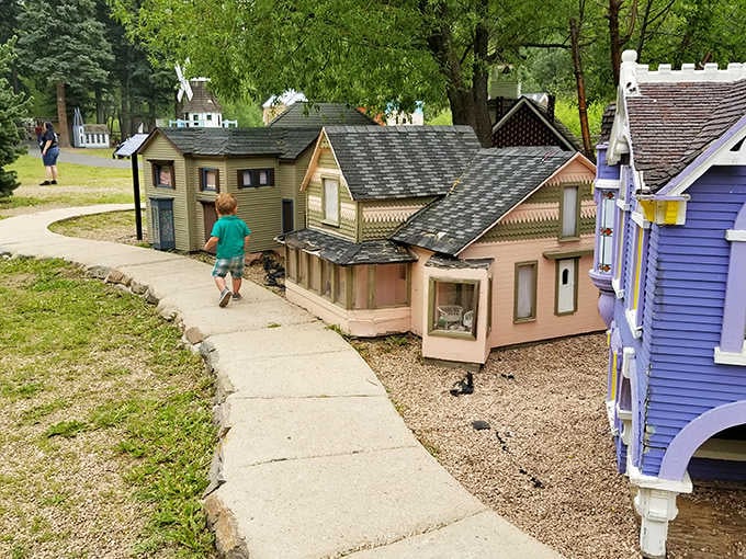 A curly-haired kid sprints past Victorian cottages and painted gingerbread trim, because some discoveries simply cannot wait another second.