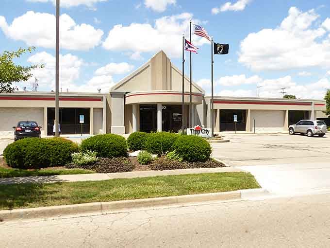 Tipp City's City Hall flying the American, Ohio, and POW/MIA flags proudly, a small town that takes its civic duties seriously.