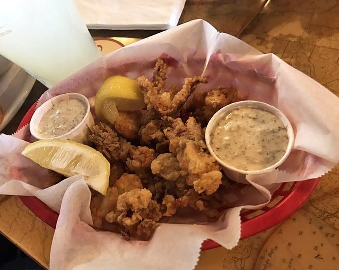 Crispy calamari with lemon wedges and dipping sauce, because sometimes you need to start strong before the main event.