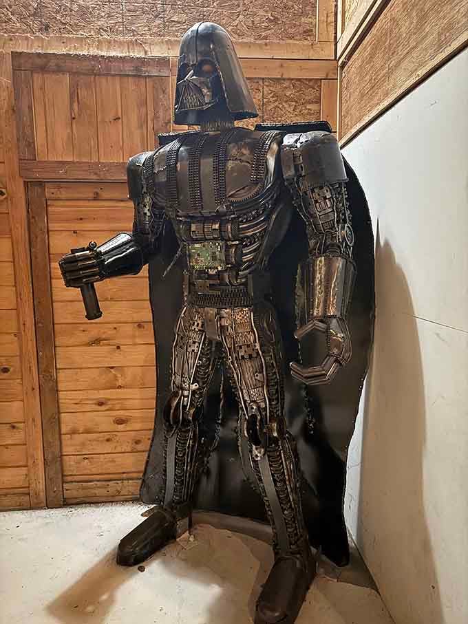 Darth Vader, assembled from recycled metal and pure imagination, commands the room without saying a single word.