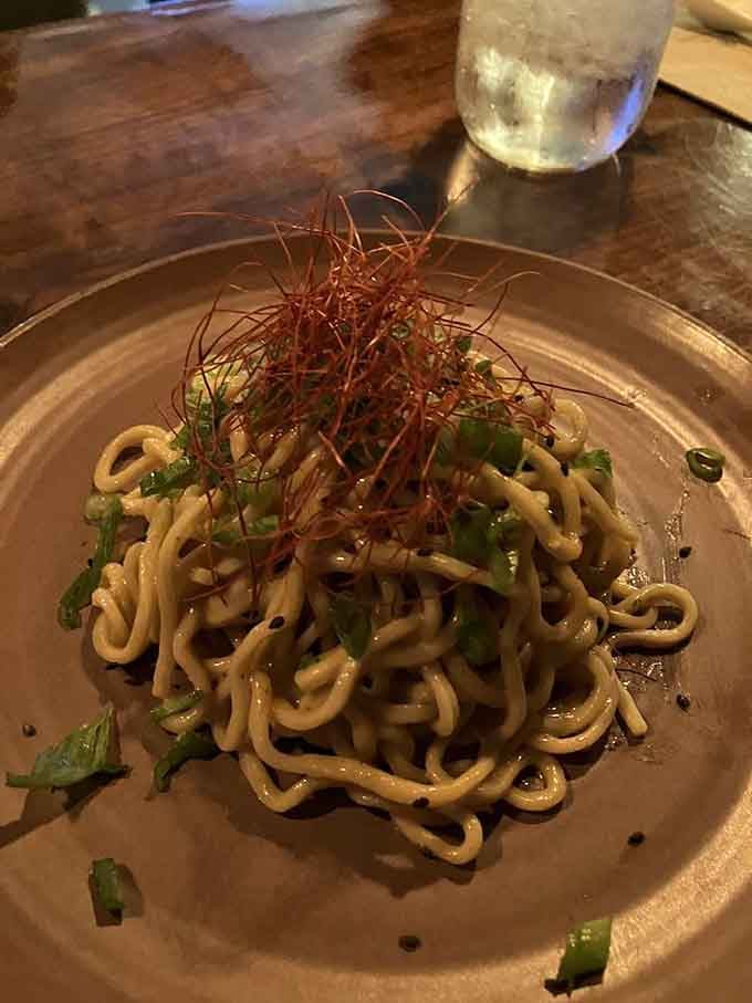 Noodles dressed up and ready for a night out, topped with delicate chili threads that mean serious business.