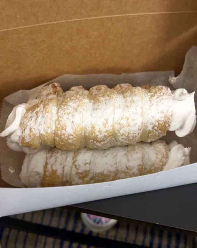 Cream horns dusted in powdered sugar, stuffed generously, and looking like the most elegant thing you'll eat all week.