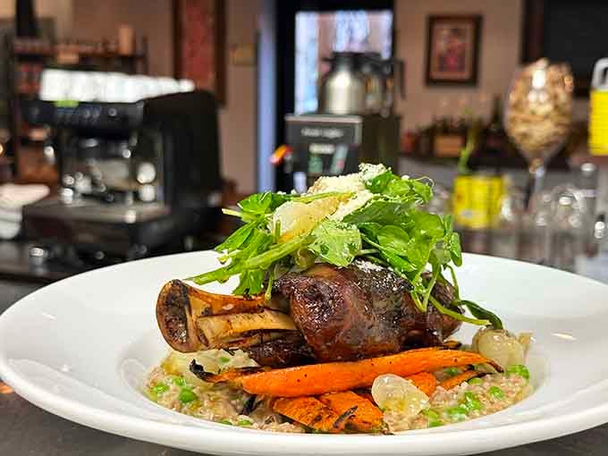 That perfectly cooked shank sitting atop risotto with grilled vegetables is basically a masterclass in how meat should be treated.