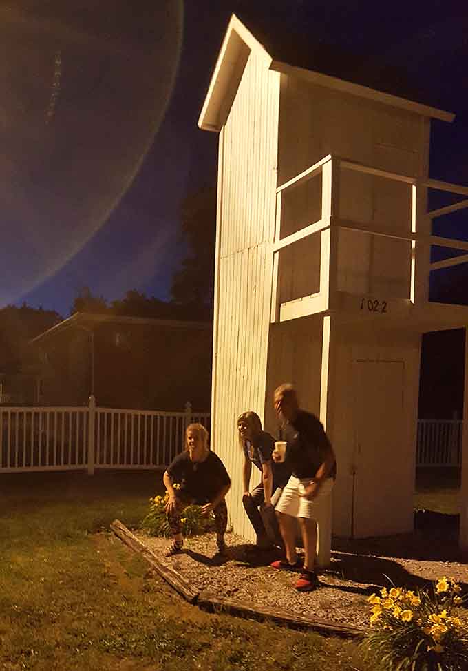 Night falls on Gays, Illinois, and the two-story outhouse glows like the roadside legend it truly is.