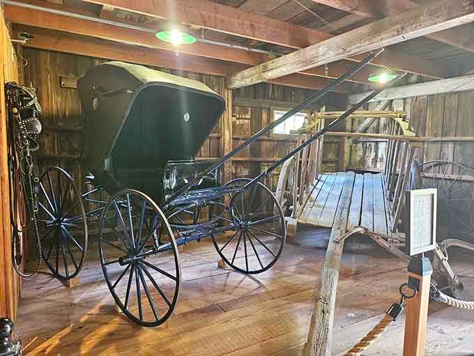 This gleaming black buggy parked inside a weathered barn is basically the 19th century's version of a very fancy road trip.
