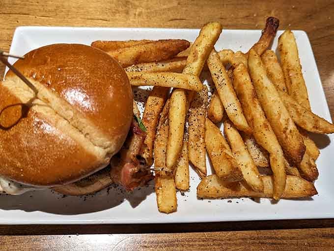 That glossy brioche bun and those perfectly seasoned fries are quietly judging every sad desk lunch you've ever eaten.
