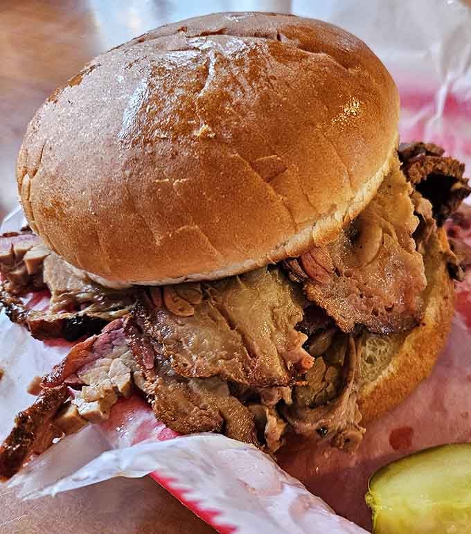That bun is barely holding on, and honestly, nobody blames it. Smoked brisket this generous plays by its own rules.