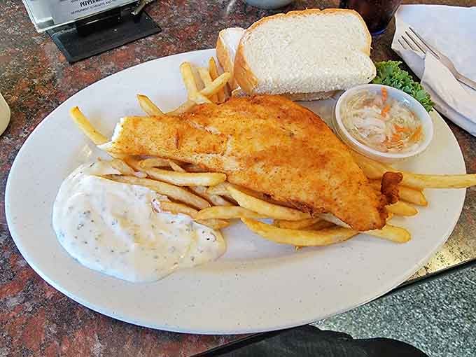 A lightly breaded haddock fillet so generous, it practically needs its own zip code on the plate.