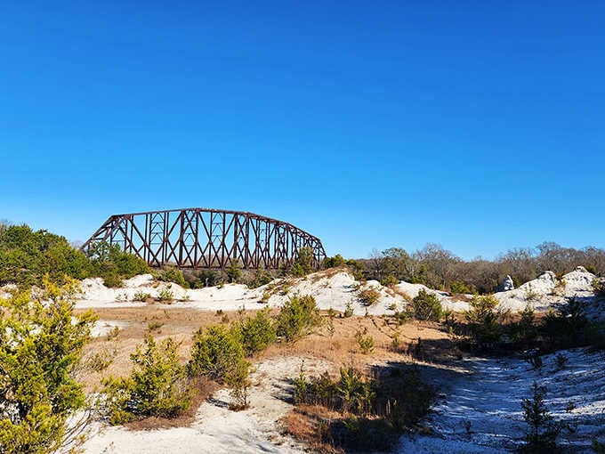 That rusty railroad bridge has been photobombing these cliffs for decades, and honestly, we're not complaining.