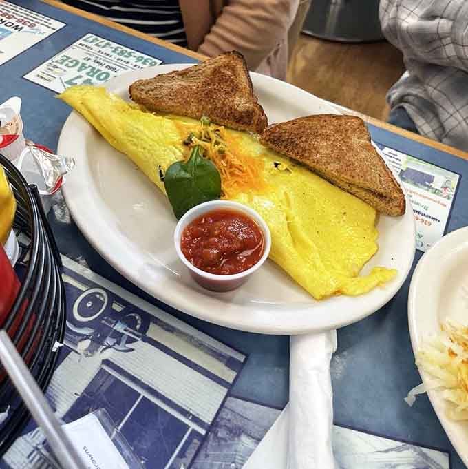 A golden omelet, toast done right, and a little cup of salsa on the side, mornings don't get more civilized than this.