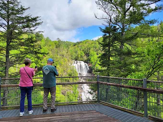 Two people, two phones, one spectacular waterfall. Some moments simply demand to be photographed immediately.