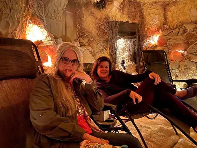Two very relaxed visitors prove that the salt cave works exactly as advertised, no convincing needed.