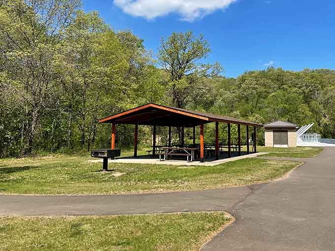 This covered picnic shelter sits quietly at the edge of the forest, basically whispering "bring sandwiches and stay a while."
