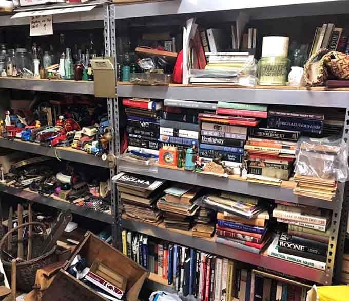 Old books, toy cars, and mason jars sharing shelf space, proof that nostalgia has absolutely no organizational system.