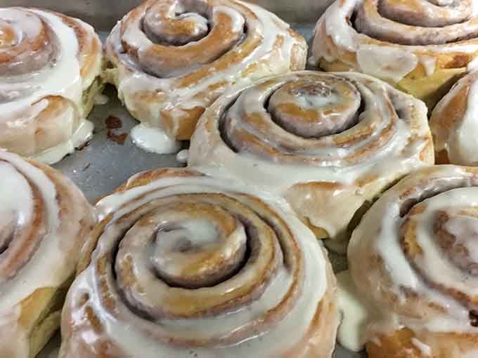 A whole pan of cinnamon rolls fresh from the oven, proof that some things in life are exactly as good as they look.