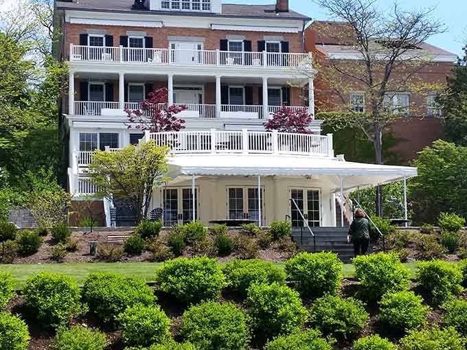 Those white balconies stacked like wedding cakes overlook manicured gardens that would make your neighbor weep with envy.