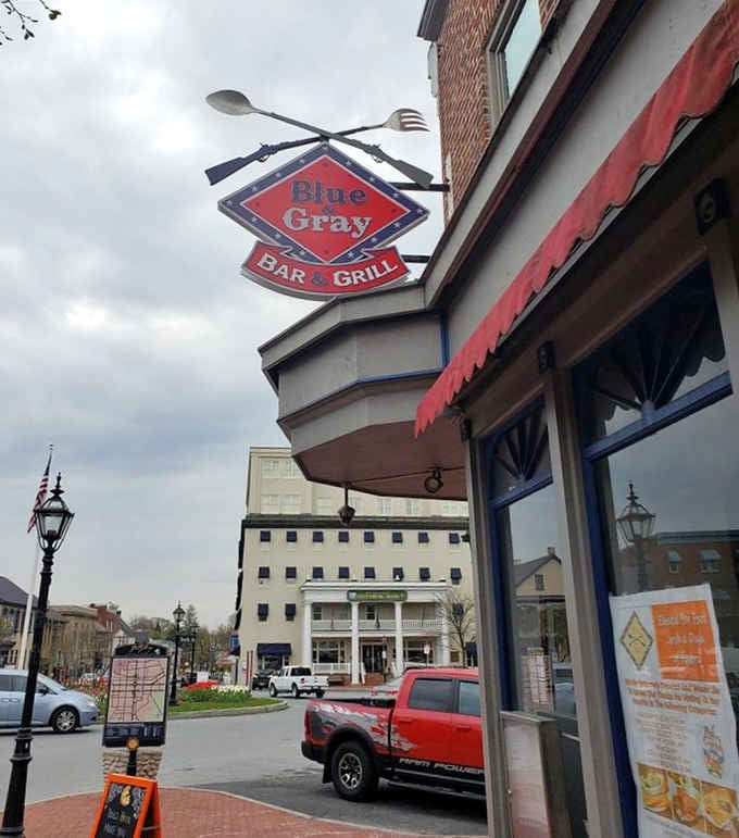 Crossed rifles and giant utensils on one sign — Blue & Gray Bar & Grill wins the battle for most unforgettable storefront in Gettysburg.