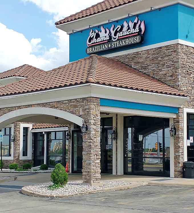 Terra cotta rooftiles and bold teal signage make Chama Ga&uacute;cha look like it teleported straight from southern Brazil to a Downers Grove corner.