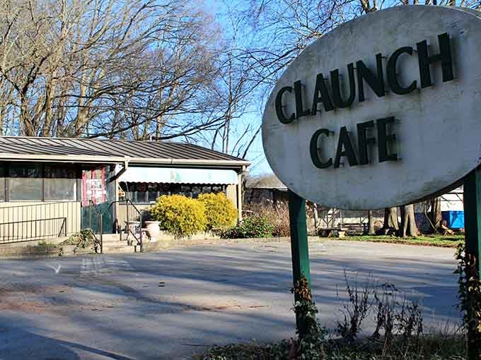 That oval Claunch Cafe sign standing tall against bare winter trees is a quiet but confident invitation to something wonderful.