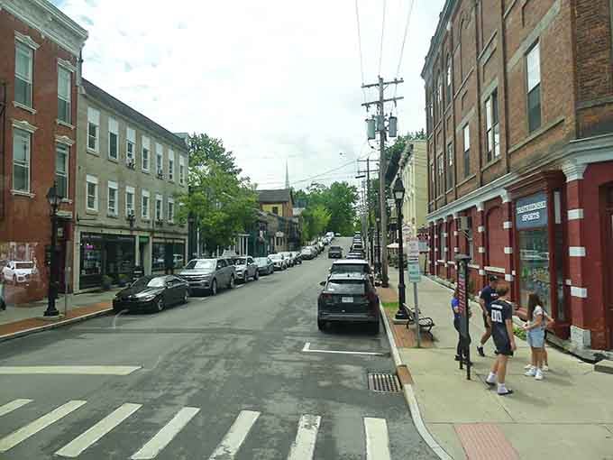Historic brick buildings line Cooperstown's streets where baseball dreams and small-town charm share the same zip code.