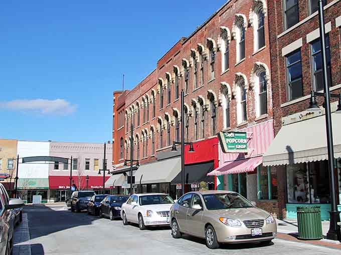 Decatur's ornate brick facades catch the winter sun beautifully, with a cheerful popcorn shop sign promising something delightful just ahead.