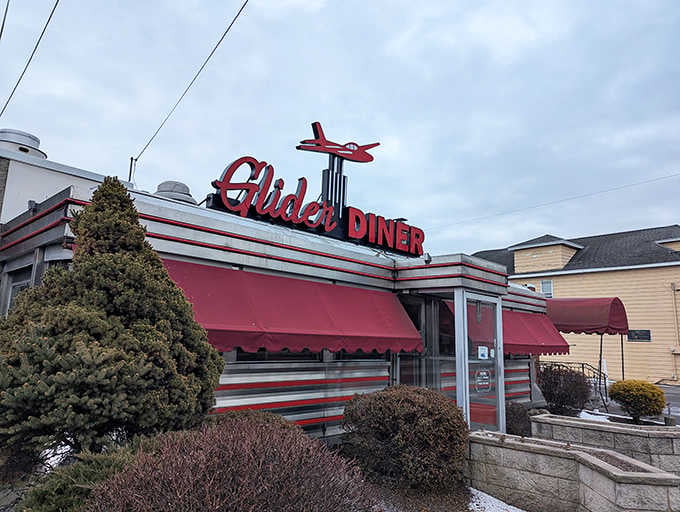 That red airplane perched on top of the Glider Diner sign makes every visit feel like a first-class comfort food flight.