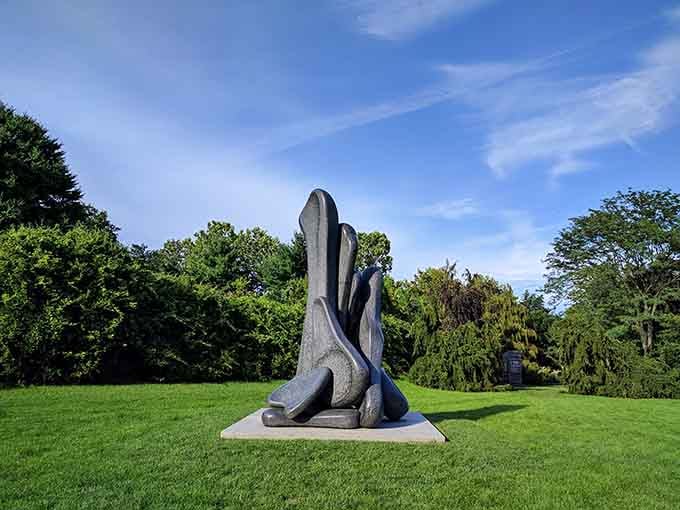Modern sculpture meets manicured lawn in this outdoor gallery where art breathes and nature applauds the collaboration.