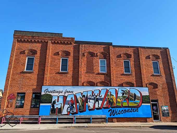 This vintage postcard mural celebrates hometown pride in letters big enough to see from space, or at least the highway.