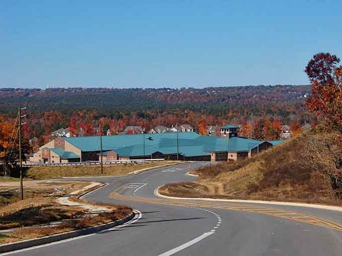 That teal roof against a hillside blazing with autumn color is pure Alabama magic.