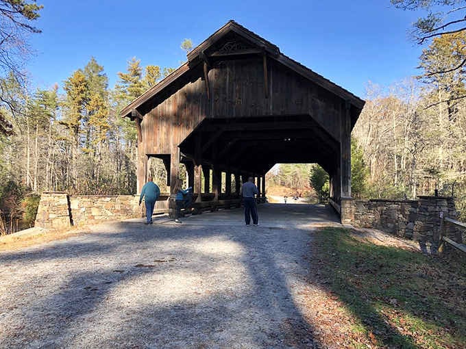 Visitors stroll through High Falls Bridge like they own the place, and honestly, who could blame them.