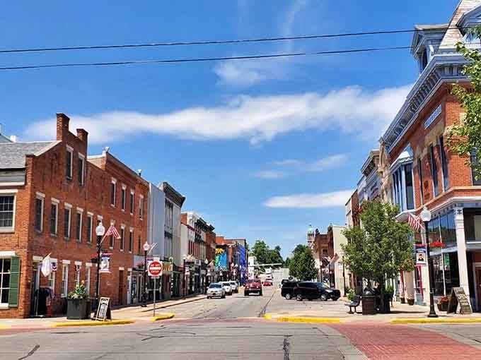 Huntington's Main Street stretches out under a wide blue sky, brick buildings standing shoulder to shoulder like old friends.