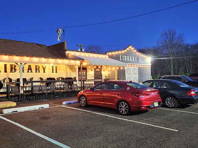 String lights outlining the roofline against a deep blue evening sky make Library II look like the best kind of surprise.