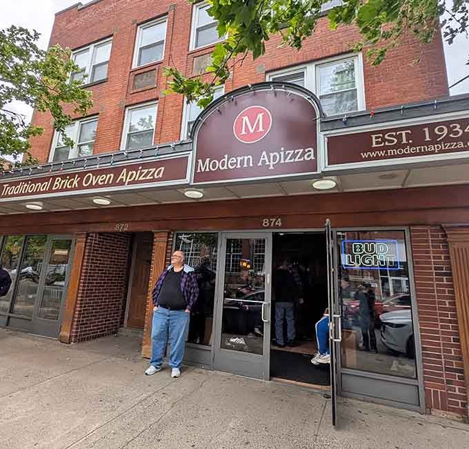 One man standing outside Modern Apizza says it all: sometimes you just need a moment before greatness.