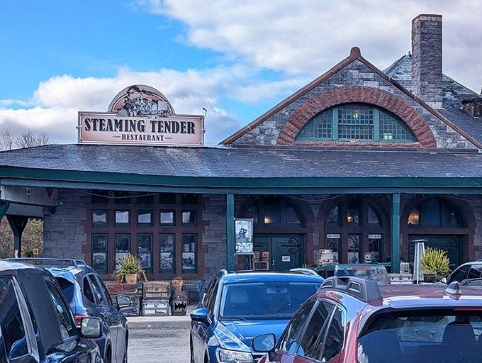 That grand arched entrance and stone chimney whisper tales of steam engines and travelers from a bygone era.