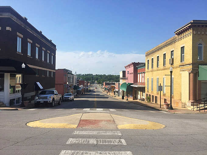 West Plains' main street stretches toward the tree-covered hills beyond, its colorful storefronts and quiet crossroads giving off serious "best kept secret in the Ozarks" energy.
