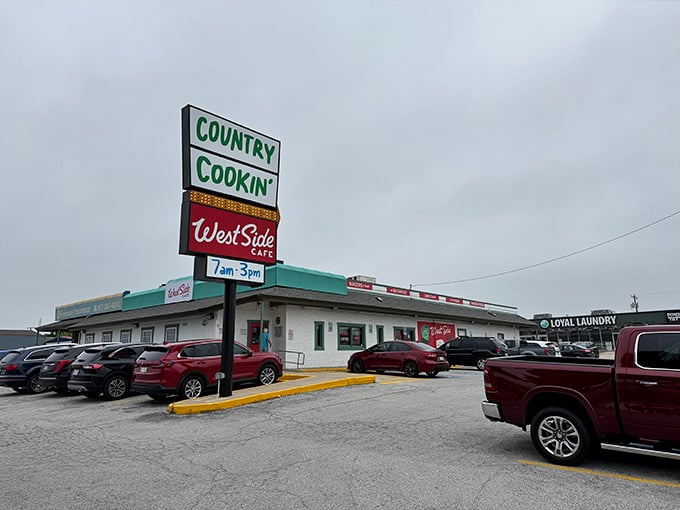 Country Cookin' in big green letters against a grey sky is the most comforting roadside promise Fort Worth has to offer.